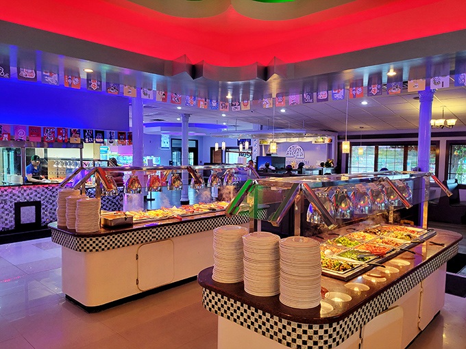 Step inside and the mood shifts dramatically&mdash;red and blue lighting transforms this buffet into what can only be described as "Asian cuisine meets 80s dance club."