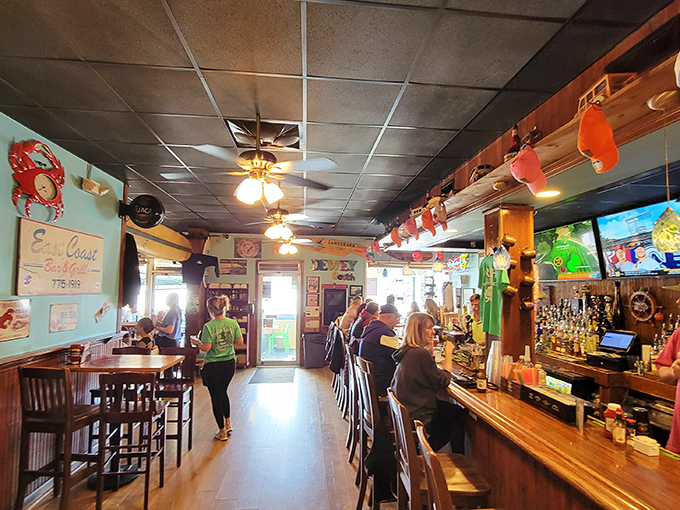 Inside Woody's, the classic beach bar vibe hits all the right notes&mdash;wooden bar, coastal decor, and locals who've found their happy place.