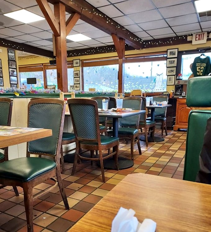 Wooden beams, twinkling lights, and green vinyl chairs create that perfect diner atmosphere where comfort food and conversation flow in equal measure.