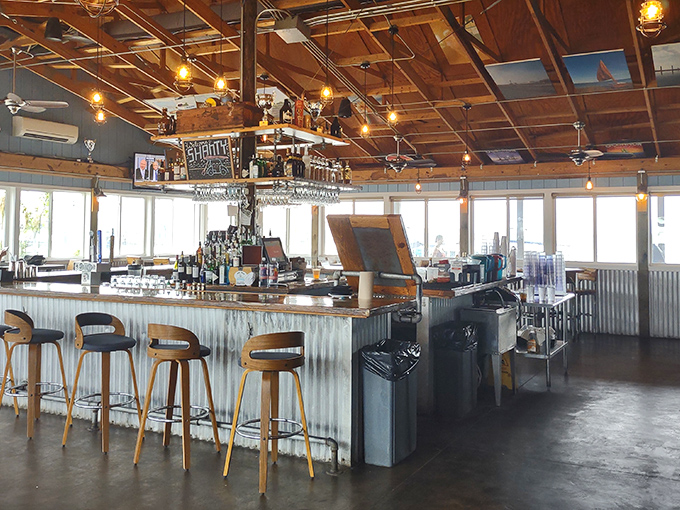 The bar at The Shanty isn't just where drinks are poured&mdash;it's command central for coastal conviviality, where corrugated metal meets exposed beams in perfect maritime harmony.