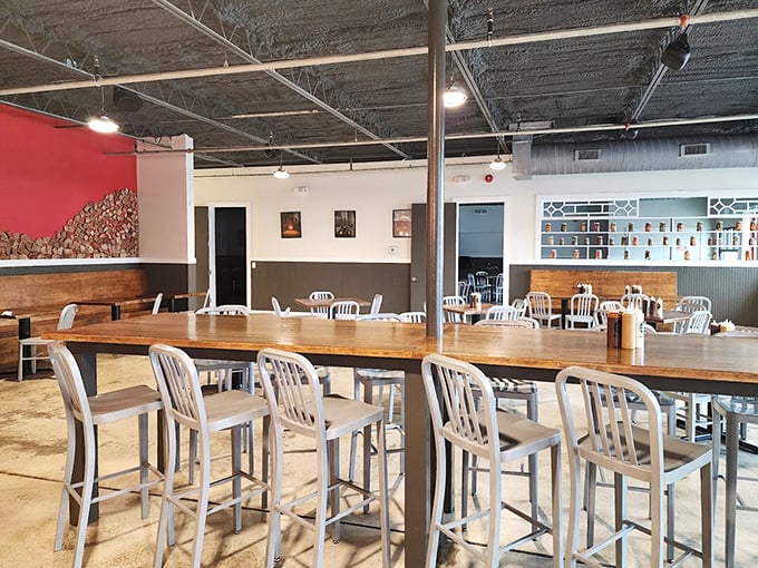 Community tables that invite conversation and the industrial-meets-rustic vibe – this is where strangers become friends over shared plates of smoky goodness.