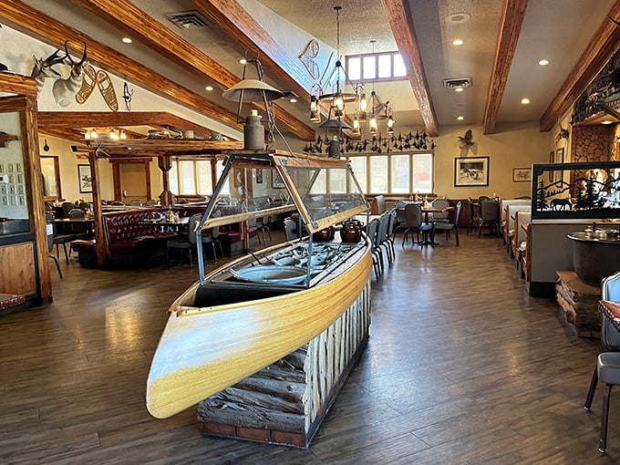 Step inside to discover a wooden canoe centerpiece that somehow makes perfect sense in this rustic dining room. Wilderness charm meets comfort.