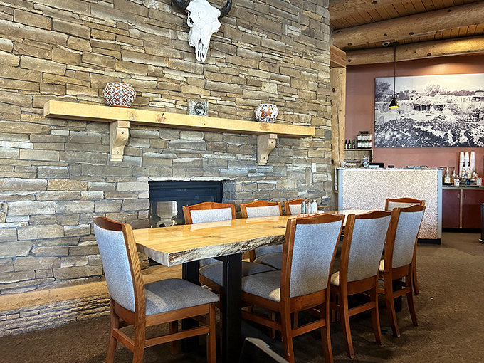 Stone walls meet wooden beams in this dining space where every meal comes with a side of cultural immersion. That buffalo skull isn't just watching&mdash;it's approving your order.