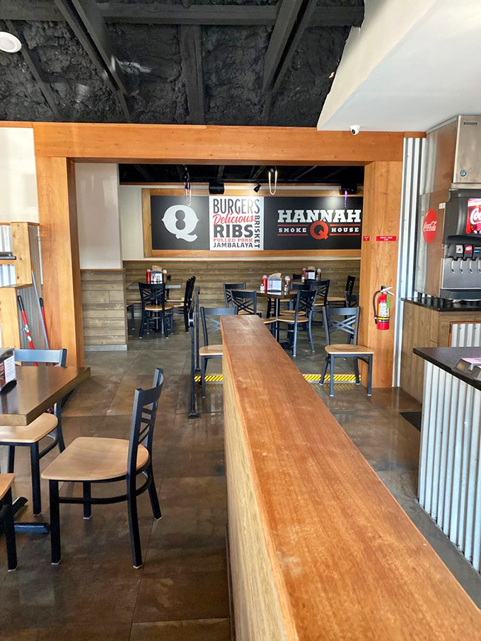 Inside, the rustic-meets-modern vibe sets the perfect stage for BBQ drama. That long wooden counter isn't just furniture&mdash;it's the gateway to meat paradise.