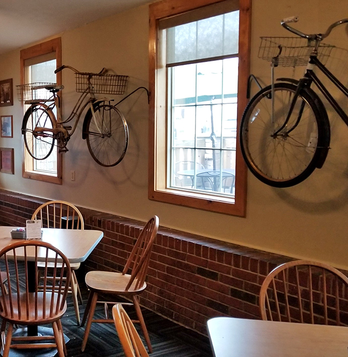 Those vintage bicycles aren't just decoration&mdash;they're conversation starters suspended in mid-journey above wooden chairs and brick walls.