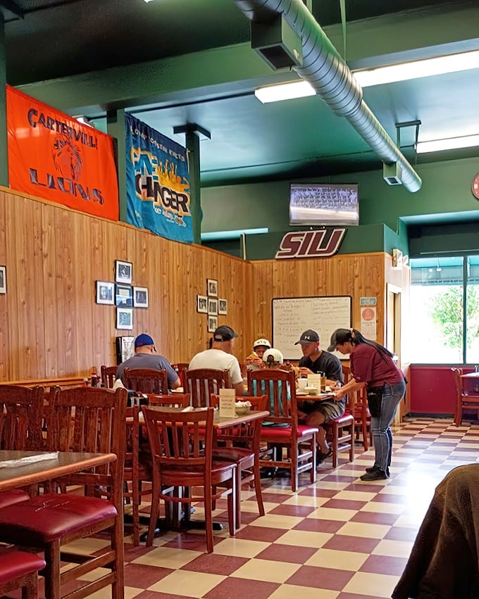 College pennants and wooden paneling create that perfect "town's living room" vibe. The checkerboard floor has witnessed generations of SIU students discovering breakfast bliss.