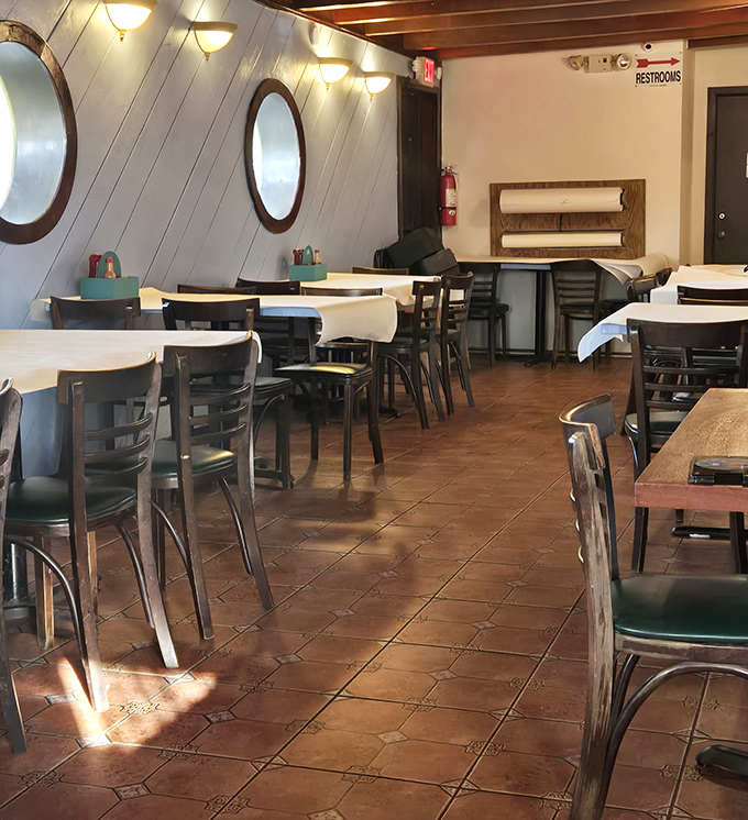 Nautical charm meets cozy dining&mdash;those porthole windows aren't just for show, they're portals to a seafood experience that transcends the ordinary.