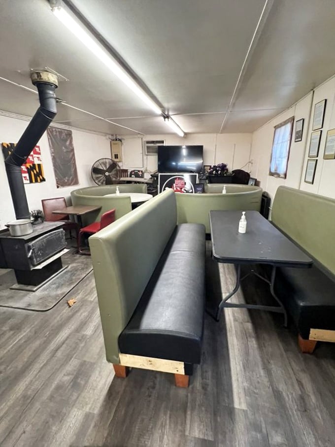 Booth seating that wouldn't win design awards but has witnessed countless BBQ epiphanies. The wood stove in the corner isn't decorative&mdash;it's essential to the Jake's experience. 