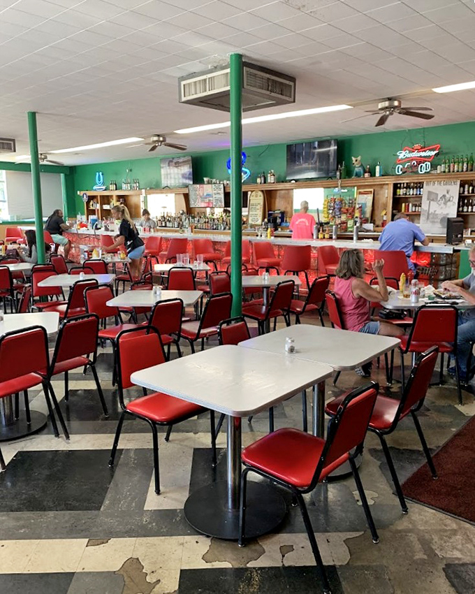 The dining room's red vinyl chairs and green walls aren't trying to be retro&mdash;they're authentic survivors from an era when function trumped Instagram aesthetics.