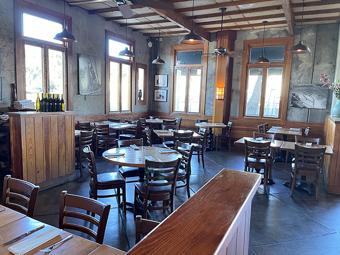 Step inside to find that perfect balance of rustic and refined – wooden tables, concrete walls, and natural light creating the ideal backdrop for oceanic indulgence.