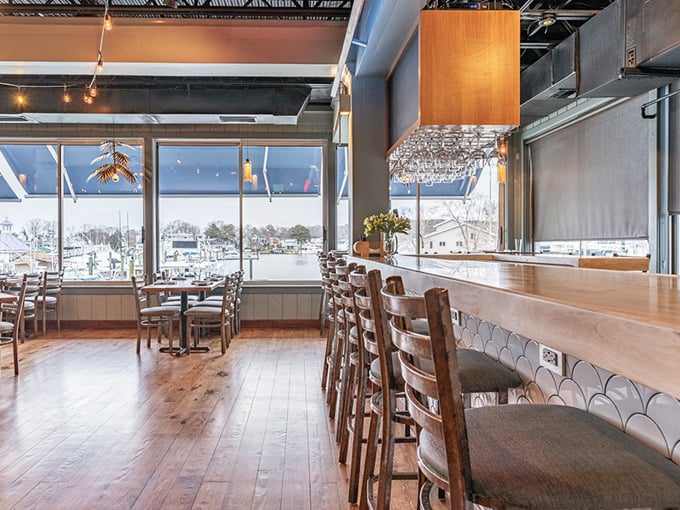 Warm wooden floors meet panoramic water views inside, where every seat feels like the captain's table and no seafood dream goes unfulfilled.