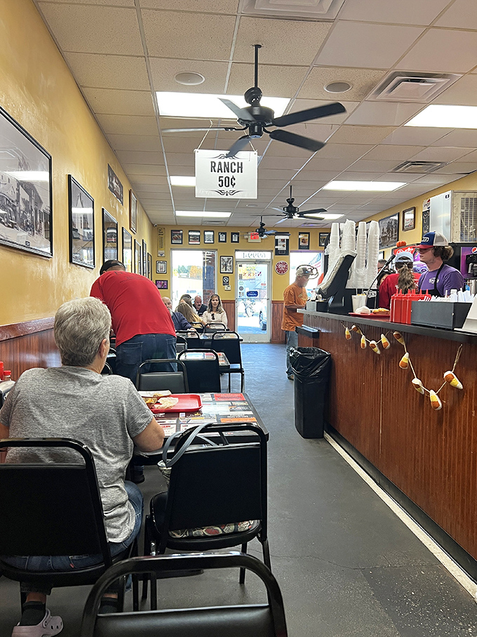 Yellow walls lined with local history, ceiling fans spinning lazily overhead, and that unmistakable aroma of comfort food filling every corner of Nick's.