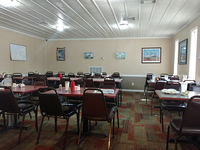 Simple tables, practical chairs, and zero pretension&mdash;this dining room isn't trying to impress Instagram, just your taste buds. And that's refreshingly honest in today's world.