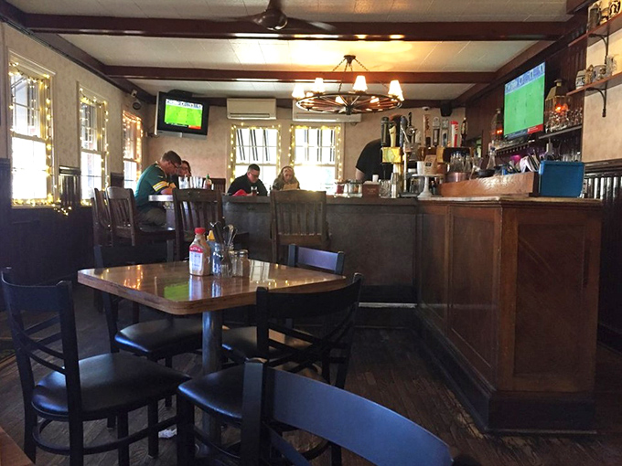 A classic American tavern in all its wood-paneled glory, where the warm lighting makes everyone look like they've just gotten back from vacation.