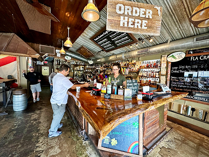 Where rustic meets refreshment &ndash; this bar isn't just serving drinks, it's serving stories with every pour beneath that corrugated metal ceiling.