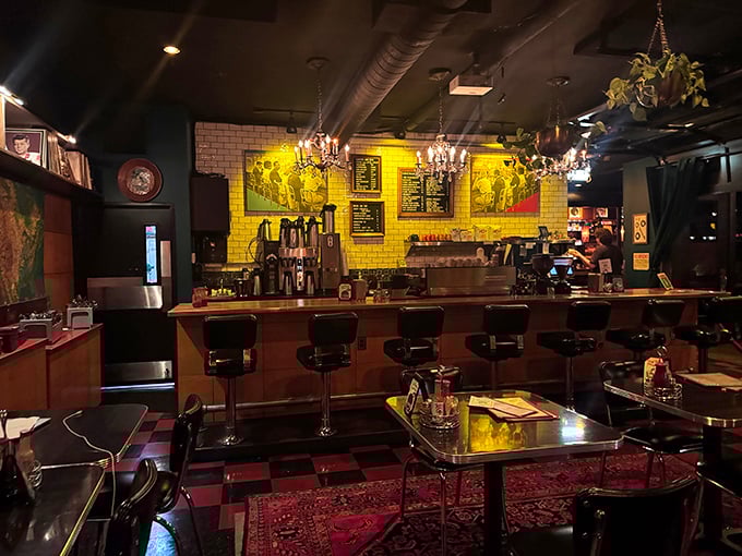 The interior strikes that perfect Portland balance: vintage chandeliers hanging over red-and-black checkerboard floors, with oriental rugs adding warmth to industrial chic.