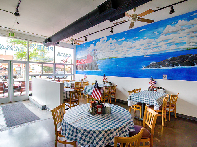 New England nostalgia meets San Diego sunshine in this charming interior, where blue-checkered tablecloths and a coastal mural transport you straight to Maine without the airfare.