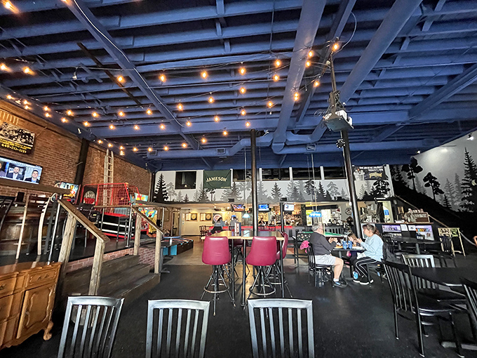 String lights cast a warm glow across the industrial-chic interior, creating that perfect "I've discovered something special" atmosphere that makes you want to settle in for the evening.