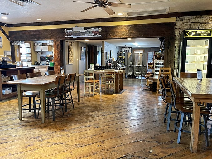 Wide-plank wooden floors and exposed beams create a dining space that feels like the Pennsylvania farmhouse you wish you grew up in.