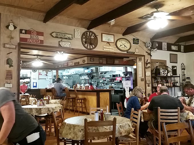 Where rustic charm meets home cooking magic. The walls tell stories while ceiling fans circulate aromas that make decision-making deliciously difficult.