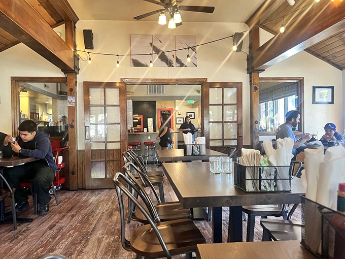 Exposed beams and string lights create that "I've discovered somewhere special" feeling locals try to keep to themselves.