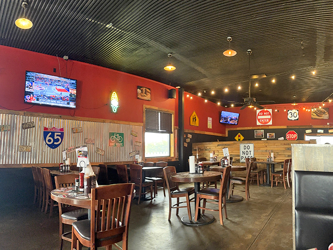 Road trip memorabilia meets comfort dining. The corrugated metal ceiling and vintage signs create the perfect backdrop for serious meat appreciation.