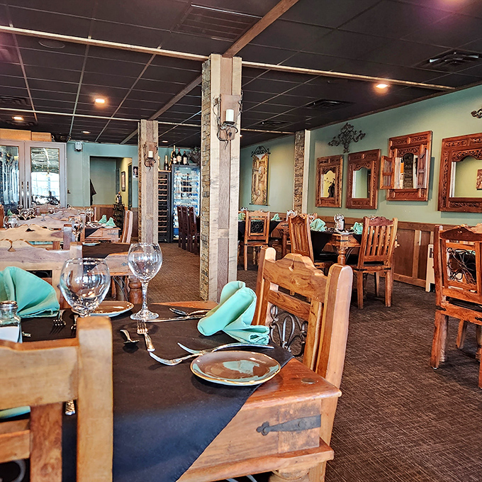 Rustic wooden tables and teal accents create the perfect backdrop for the meat-centric masterpieces to come.