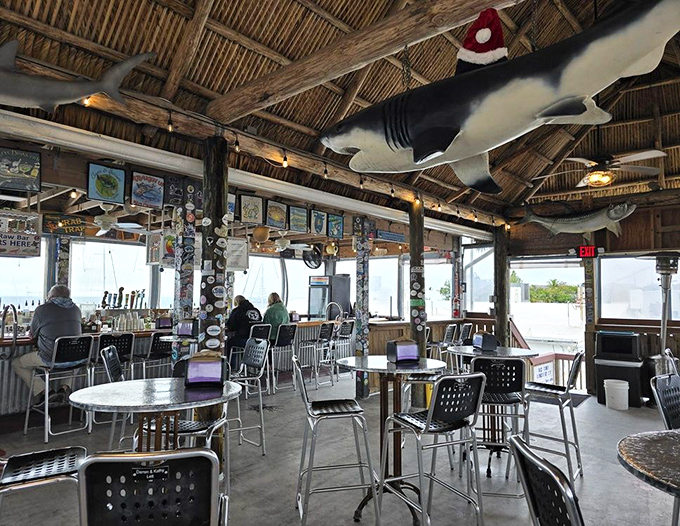 Dining under a thatched roof with a shark overhead? Just another Tuesday in the Keys, where the decor is as authentic as the seafood.