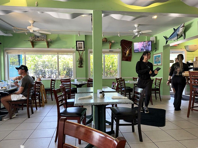 Mint green walls and wooden chairs create that perfect "I've discovered something special" atmosphere. The kind of place where calories don't count because you're on vacation.