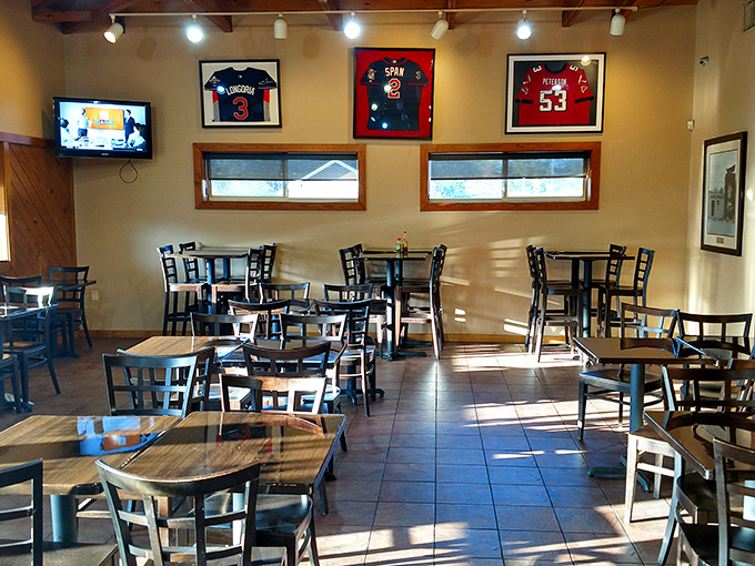 Simple tables, framed jerseys, and the promise of barbecue bliss. No Edison bulbs or reclaimed wood here&mdash;just a temple to honest-to-goodness flavor.