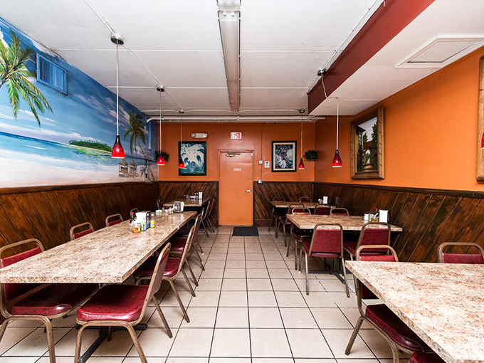 Inside, warm orange walls and beach murals create that perfect "vacation in Mexico meets Florida charm" vibe. Those red pendant lights cast a glow that makes everyone look like they're in love.