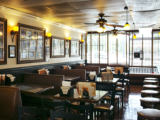Warm lighting, wood paneling, and cozy booths create the perfect backdrop for soul food communion. This isn't just dining&mdash;it's a Southern living room.