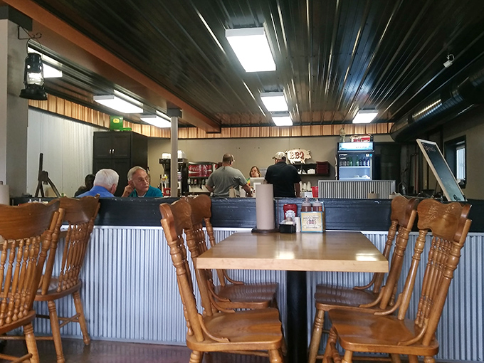 Inside, corrugated metal meets wooden chairs in a no-frills space where the food does all the talking.