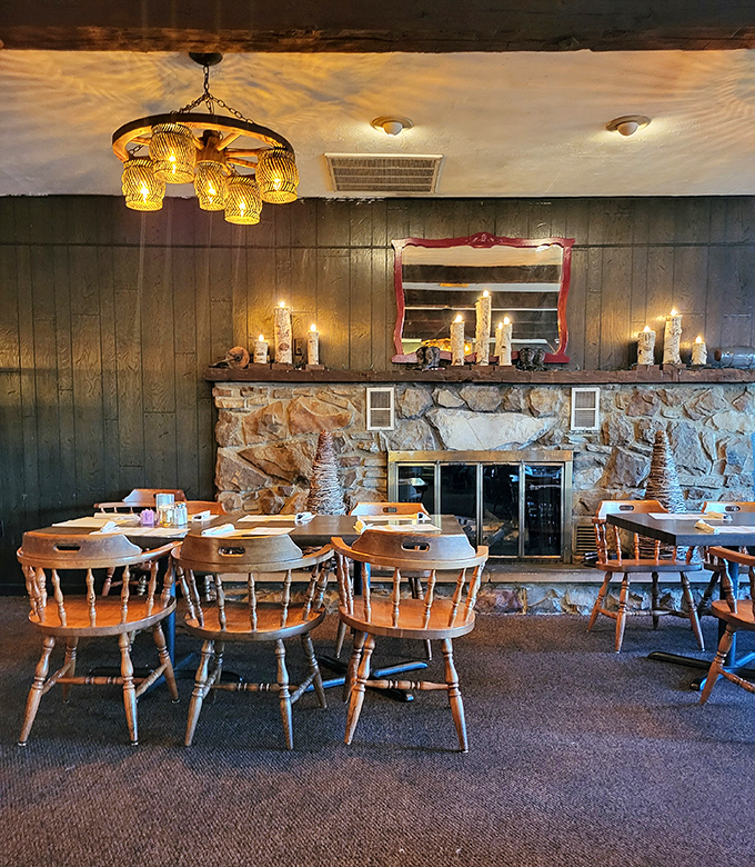The stone fireplace and captain's chairs create that "grandma's fancy dining room" atmosphere where memories are made between bites.
