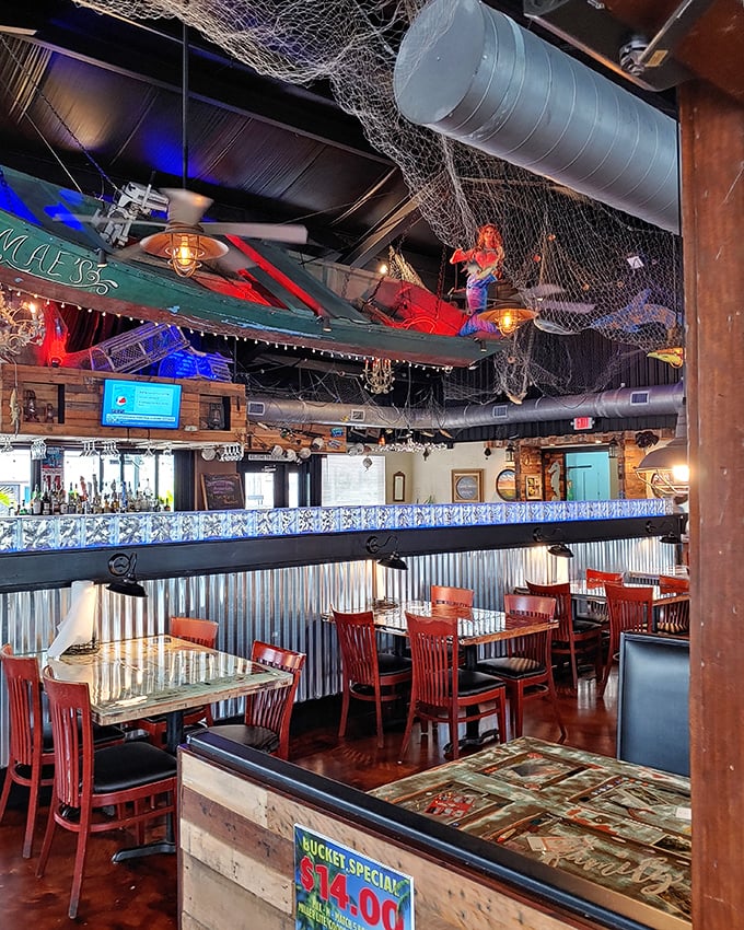 Fishing nets drape from the ceiling while blue lighting transforms the bar into an underwater paradise. Somehow, everything tastes better beneath a mermaid's chandelier.