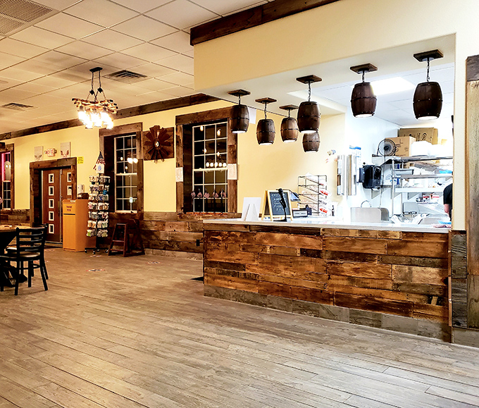 Rustic charm meets functional design in this welcoming interior. Those barrel light fixtures aren't just for show&mdash;they're setting the mood for serious meat appreciation.