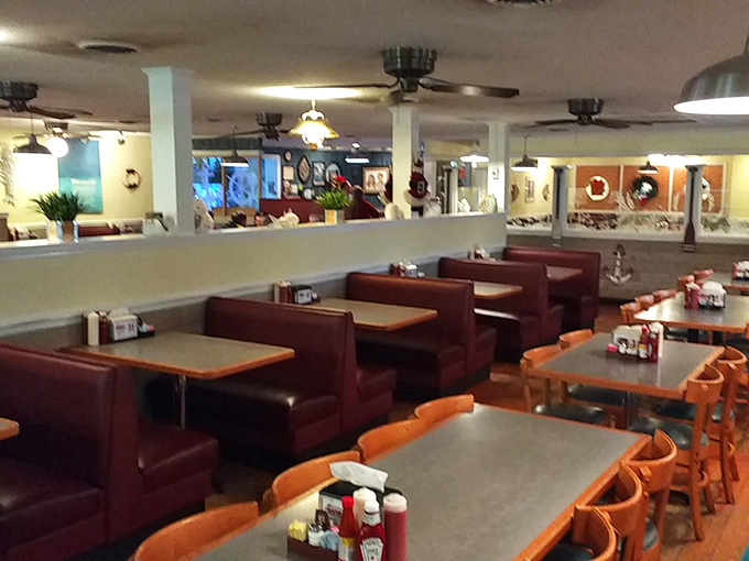 Classic burgundy booths and nautical touches create that perfect "come as you are" vibe. The kind of place where comfort meets quality without an ounce of pretension.