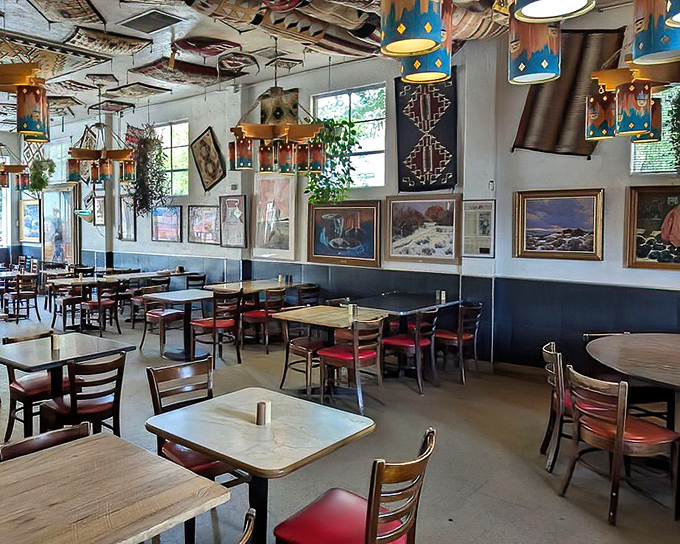 Inside Frontier, Southwestern art adorns the walls while colorful pendants cast a warm glow over simple tables where decades of Albuquerque stories have unfolded.