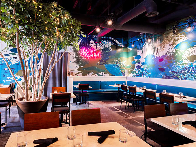 Step inside to discover a dining room where nature meets art&mdash;that stunning blue mural and indoor tree create an atmosphere that's both energizing and soothing.