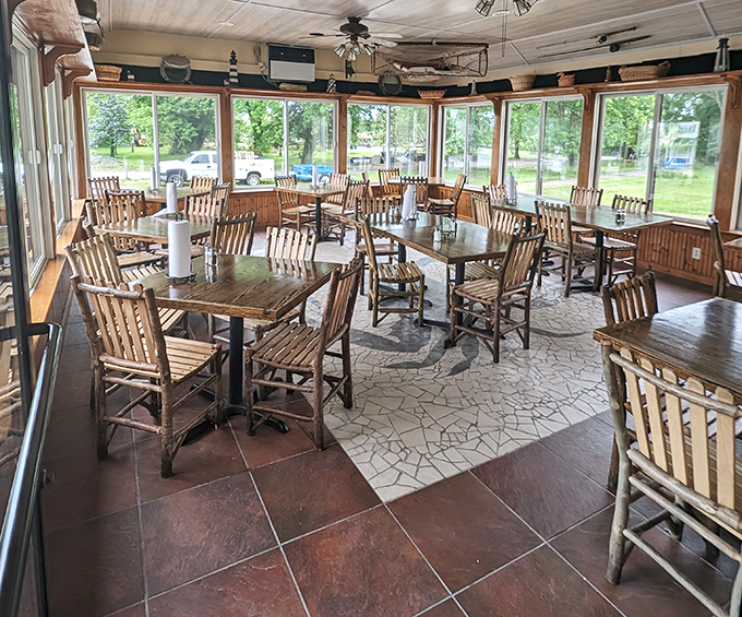 Sunlight floods the airy dining room, where wooden chairs and nautical touches create the perfect backdrop for seafood feasting.