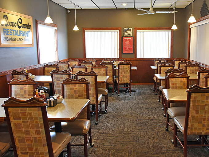 Classic checkered booth seating and warm wood tones create that perfect "come as you are" atmosphere where comfort reigns supreme and calories don't count.