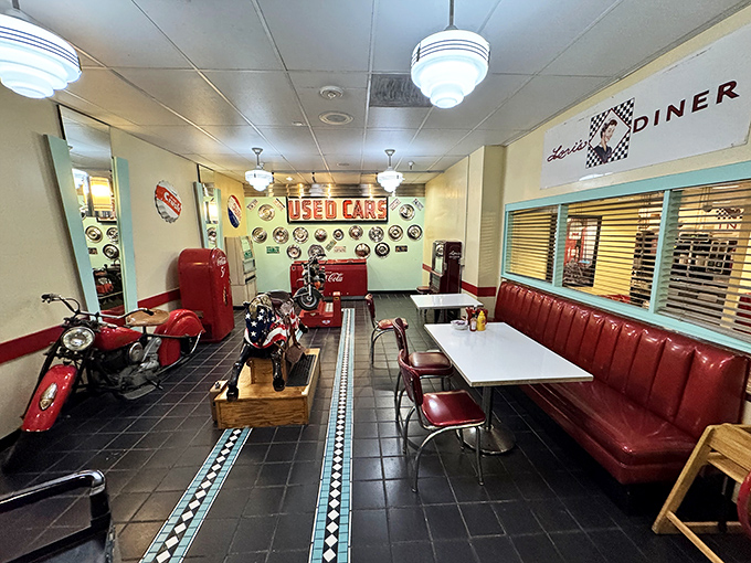 Step inside and suddenly you're starring in your own 1950s sitcom, complete with vintage motorcycles, red vinyl booths, and zero commercial breaks.