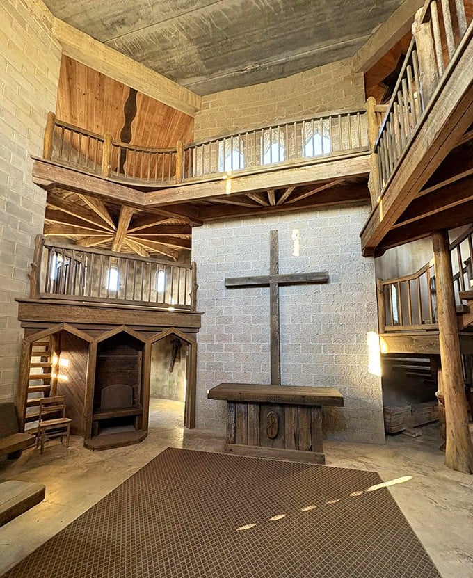 Step inside and time travel begins. Wooden balconies, stone walls, and that magnificent cross create a sacred space that whispers of ancient devotion.