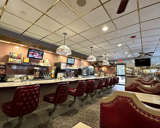 The counter where dreams are made&mdash;those burgundy stools have witnessed first dates, business deals, and countless "just one more coffee" moments.