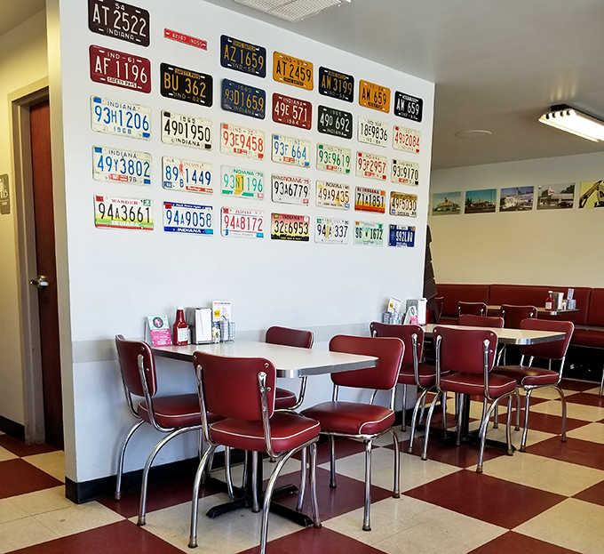 License plates from across America line the walls, a road trip in suspended animation while you contemplate whether to order the Denver omelet or Philly cheesesteak.