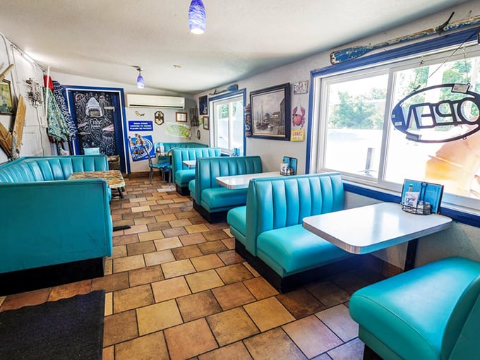 Retro turquoise booths invite you to slide in and stay awhile. These vinyl time machines are the perfect perch for seafood feasting.