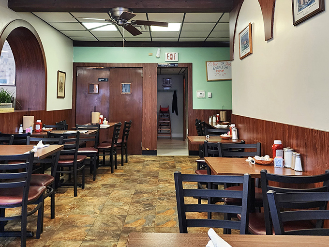 Step inside and time slows down. The mint green walls and wood paneling create that perfect "grandma's kitchen meets neighborhood gathering spot" vibe.