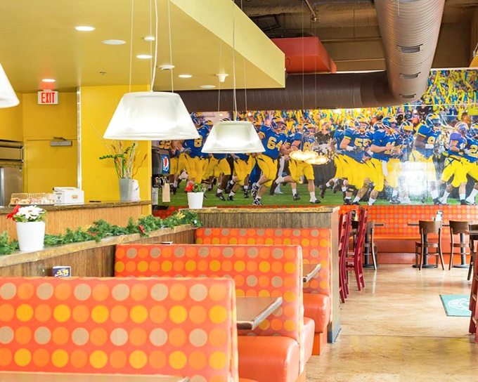 Bright orange booths and Delaware football murals create the perfect backdrop for the serious sandwich business happening at the counter.