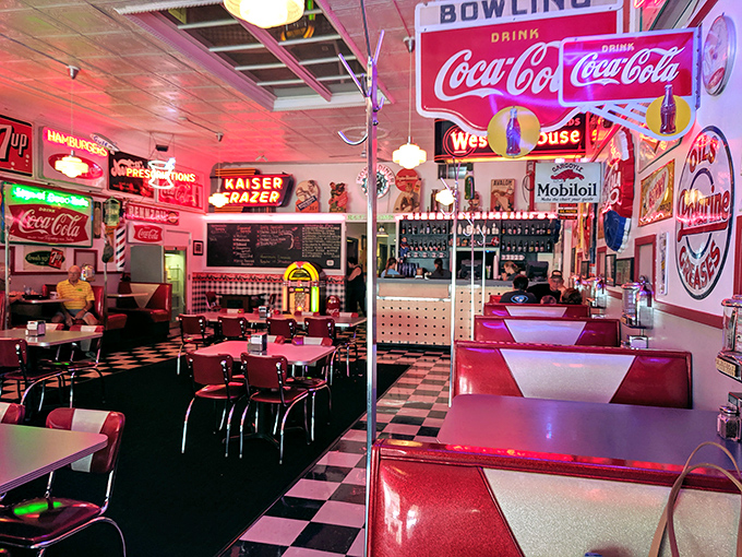 Step inside and suddenly you're in a neon-lit wonderland where the checkered floor practically demands you do the twist while waiting for your blue plate special.
