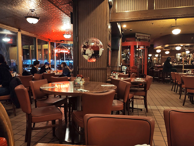 Inside Tom's, time stands deliciously still. The warm glow of vintage lighting transforms ordinary meals into memory-making moments.